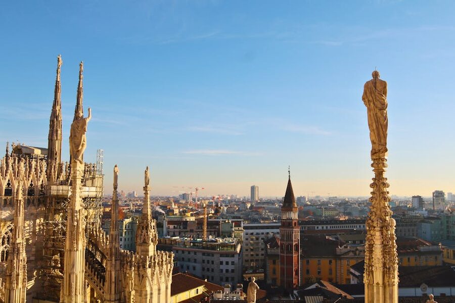 Milan rooftop view with statues and skyline