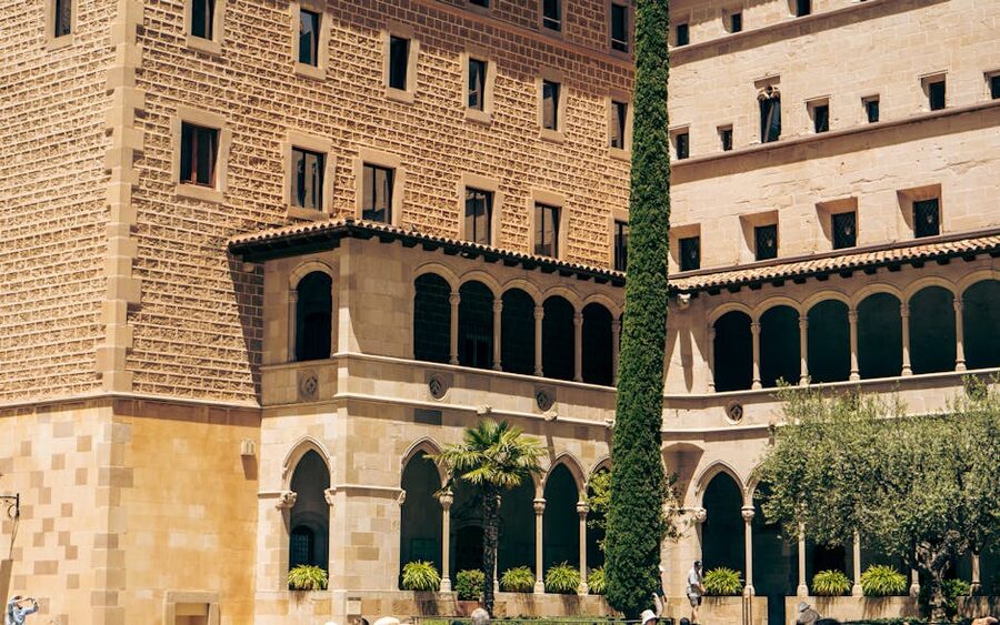 Stone facade of the Montserrat monastery in afternoon light
