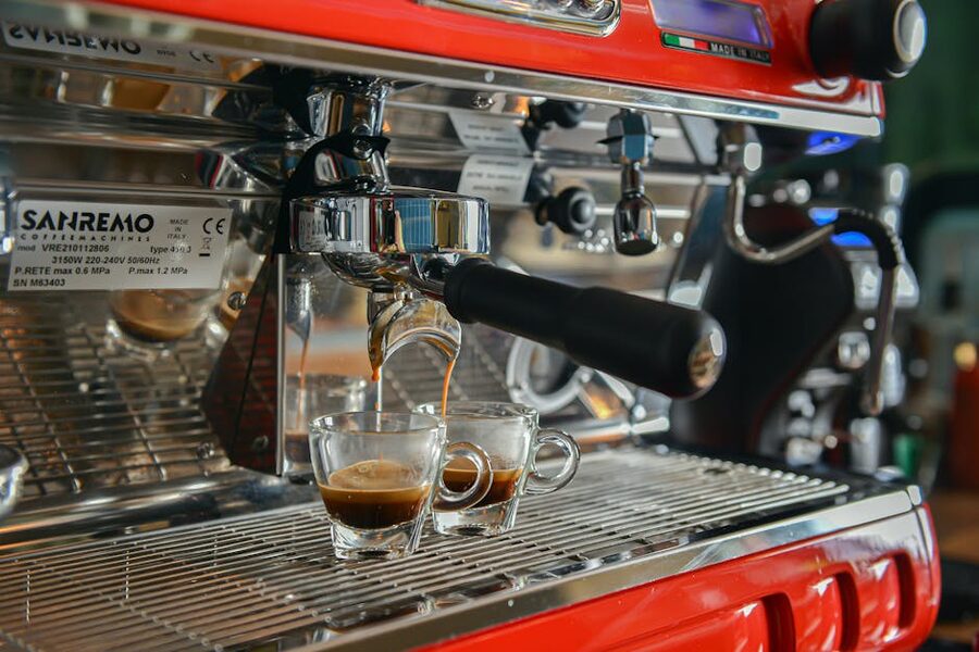 Espresso machine pouring coffee in Italian cafe