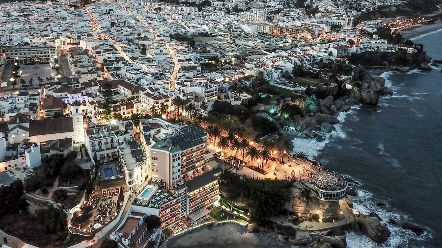Balcón de Europa at night with illuminated lights and sea