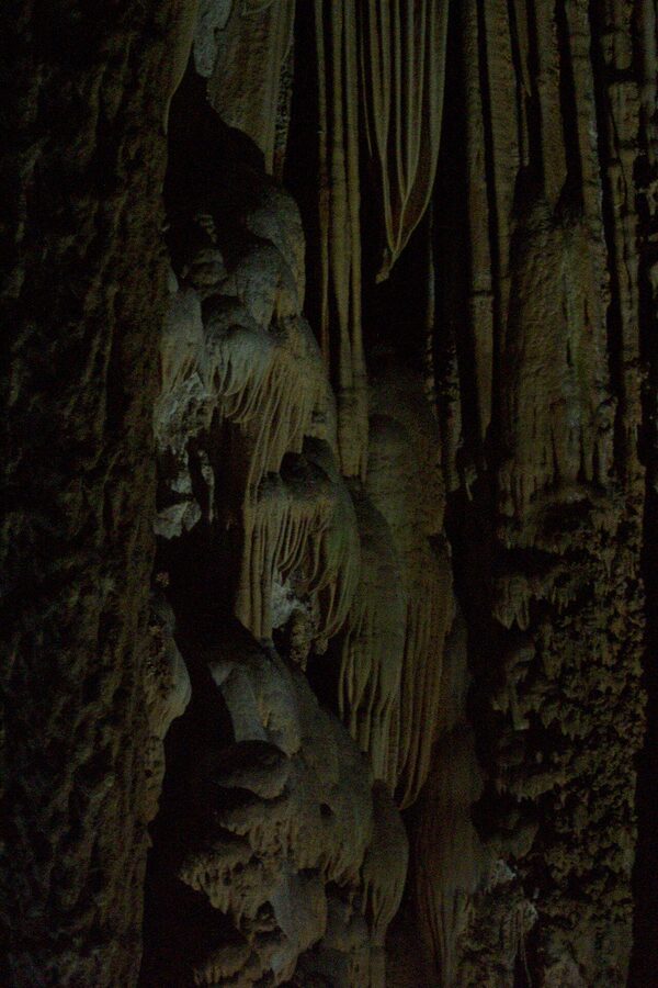 Illuminated chamber inside the Caves of Nerja with cave formations