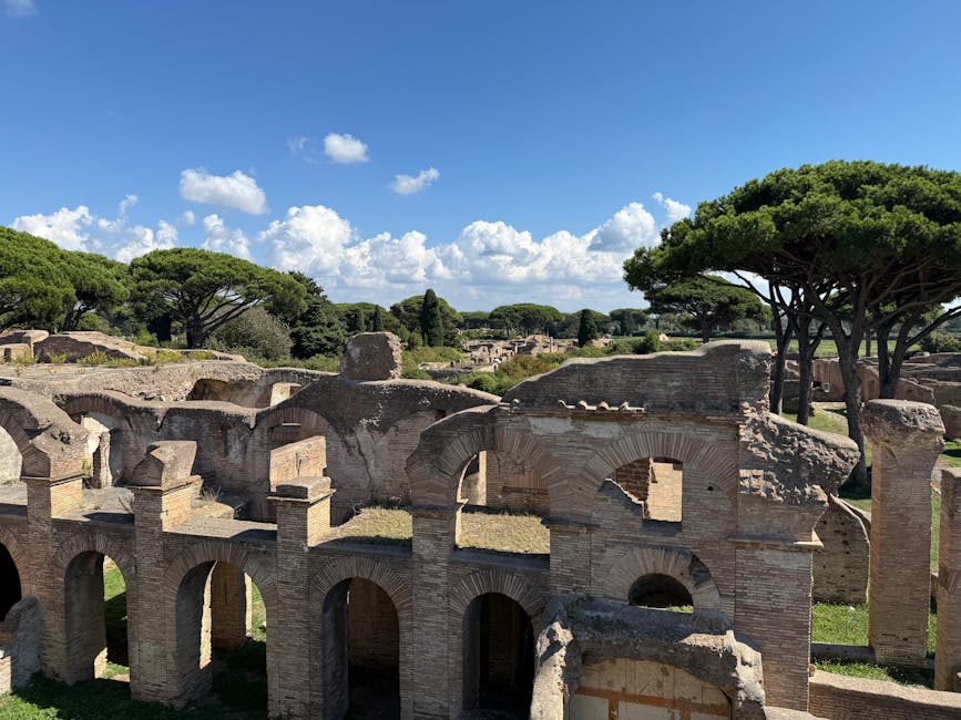 Ancient ruins of Ostia Antica with trees and blue sky