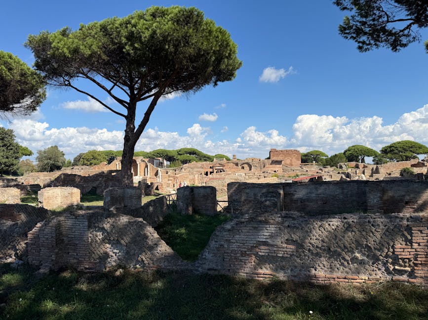 Preserved Roman ruins at Ostia Antica with greenery and blue sky