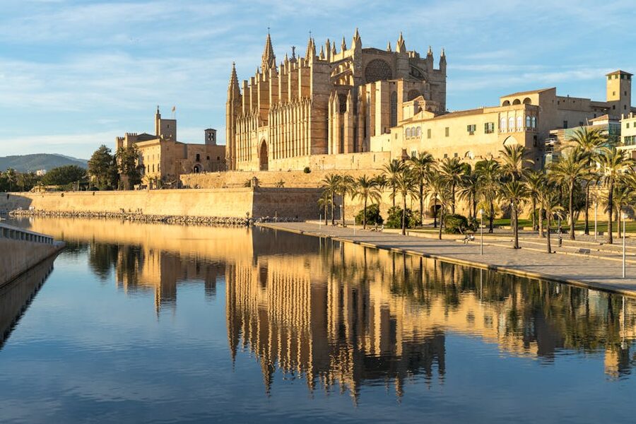 La Seu cathedral reflected in the Parc de la Mar pool, Palma de Mallorca