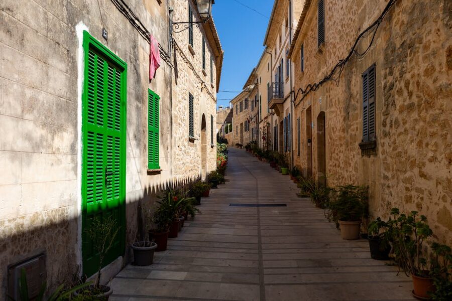 Stone houses lining a quiet alley in the old town of Palma
