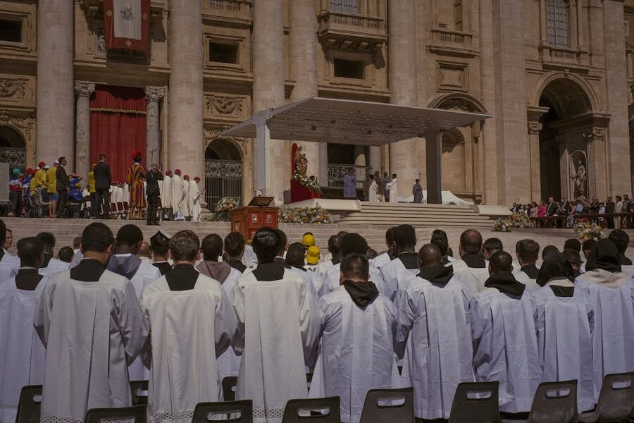 Priests gathering for a religious ceremony at St. Peter's Basilica