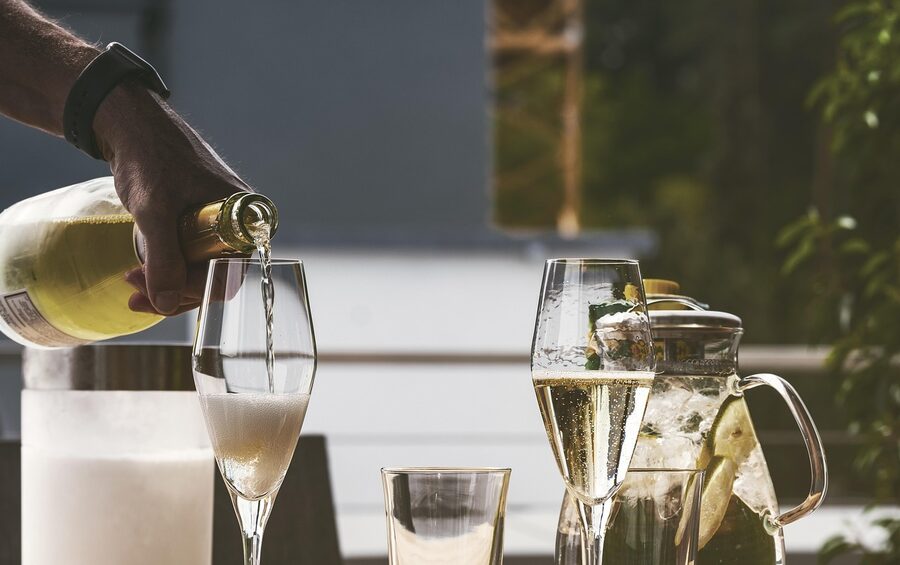 Cava poured into a glass with bubbles rising in close-up