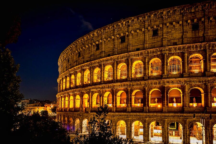 Colosseum facade lit up at night close detail