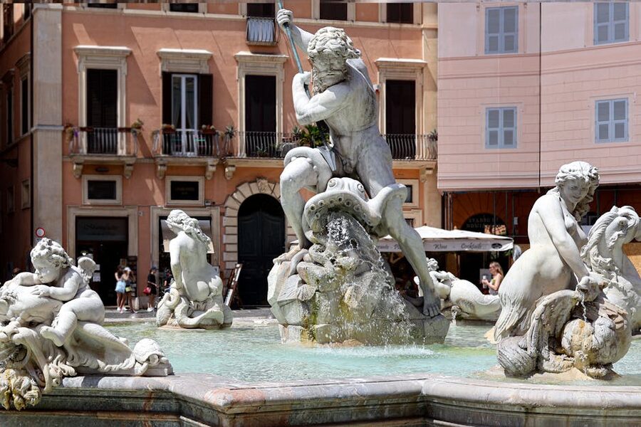 Baroque fountain in sunny Piazza Navona, Rome