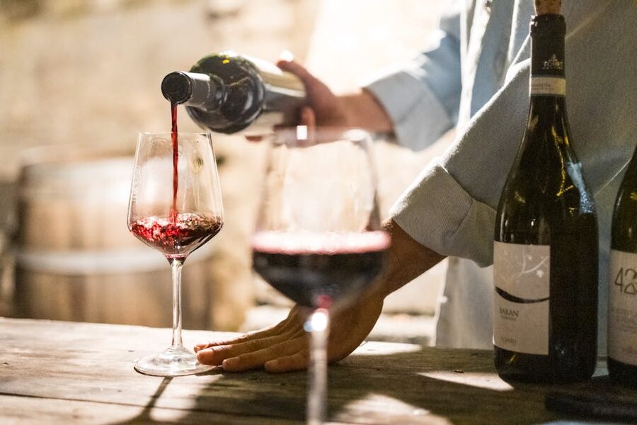 Pouring red wine at a Tuscan winery