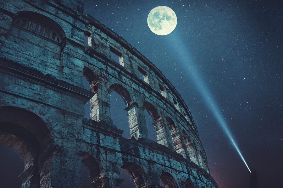 Colosseum exterior under moonlight