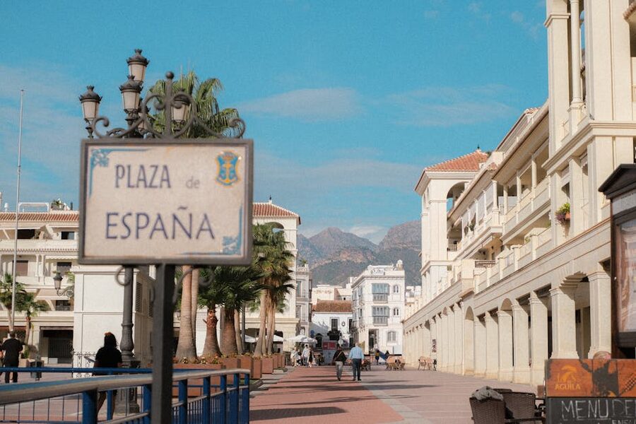 Plaza de España in Nerja with palm trees and white buildings