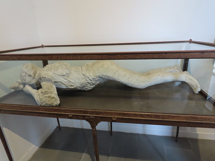 Plaster cast of a Pompeii eruption victim displayed at the site