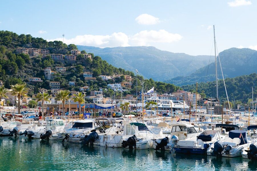 Port de Soller marina with boats and hillside houses
