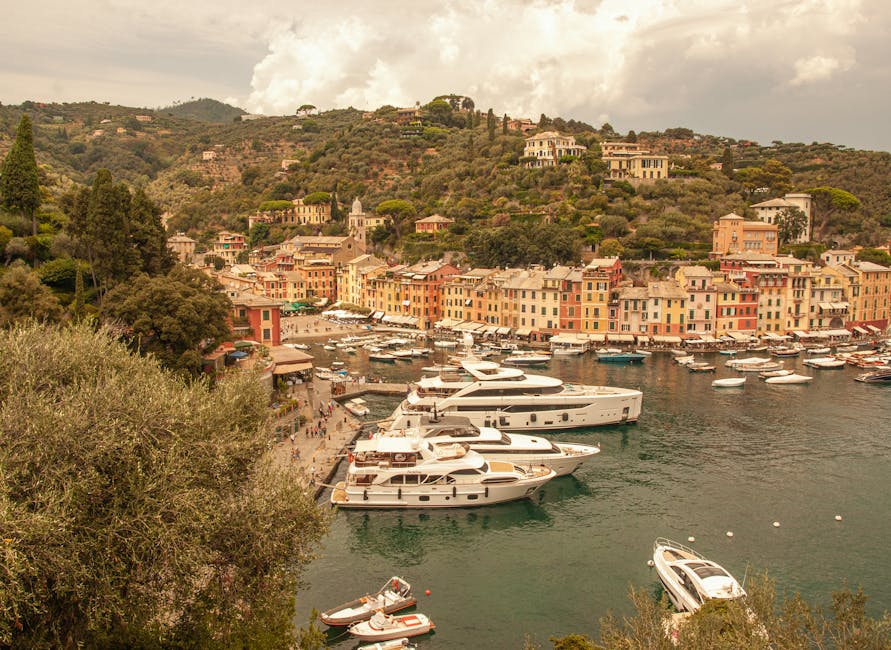 Portofino harbor with moored yachts and colorful hillside houses