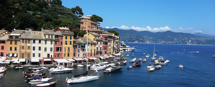 Portofino on the Italian Riviera with pastel buildings reflected in the harbor