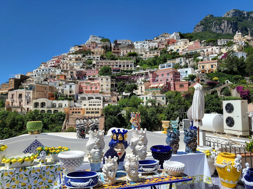 Ceramic figurines and bowls on display in Positano