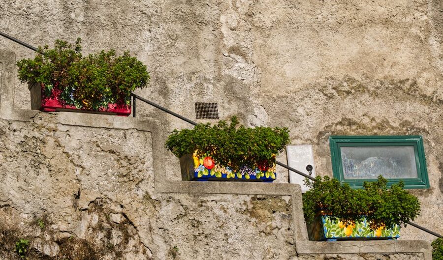 Positano stone stairs with potted plants on the climb