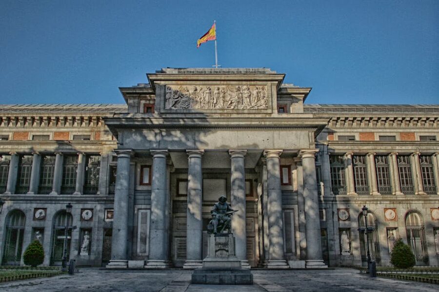 Exterior of the Prado Museum with statue in front