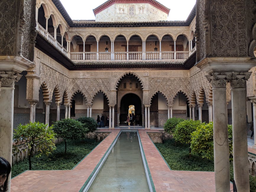 Historic courtyard with Moorish arches at Alcazar Seville