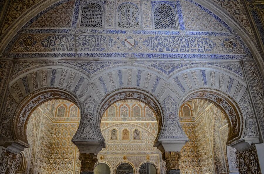 Detailed Moorish arches and tilework at Alcazar Seville