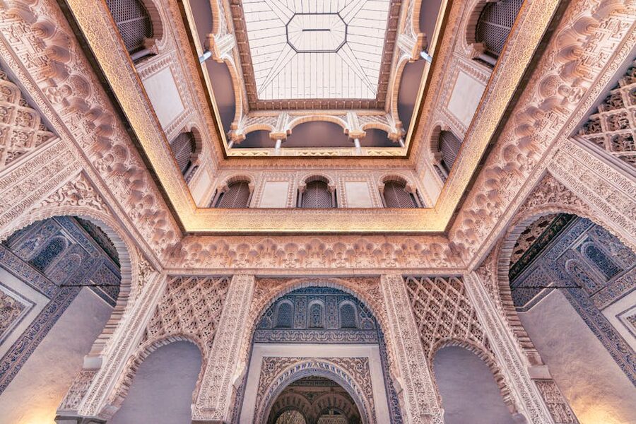 Moorish arches and ornate ceiling inside Alcazar Seville