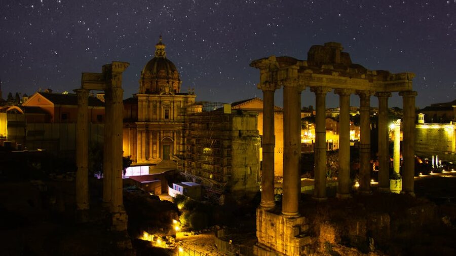 Roman Forum illuminated at night with ancient ruins
