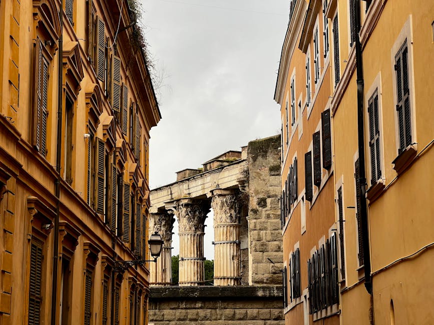 Rome alley with ancient Roman ruins flanking modern apartment buildings