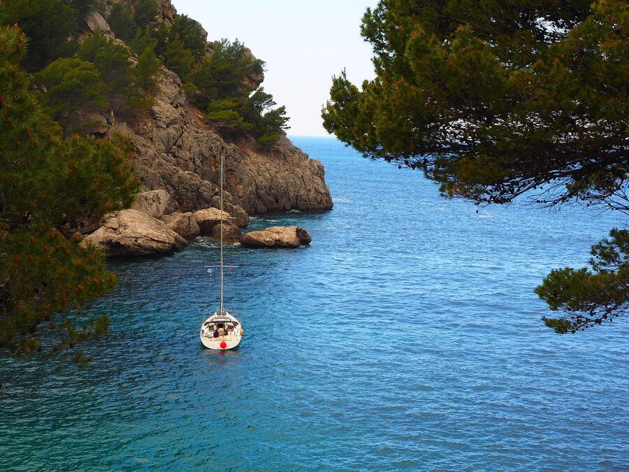 Sa Calobra bay with sailing ship anchored offshore