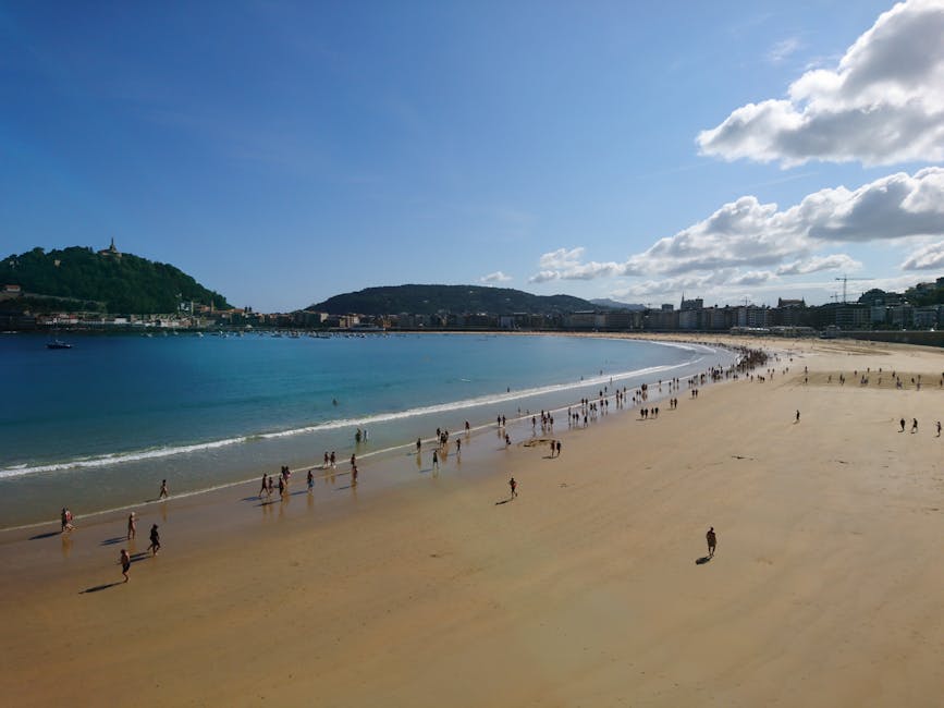 Summer afternoon at La Concha beach with crowds and clear water
