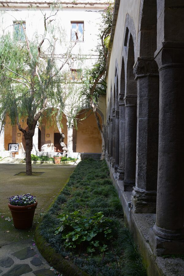 The Chiostro di San Francesco cloister in Sorrento with crossing tufa arches