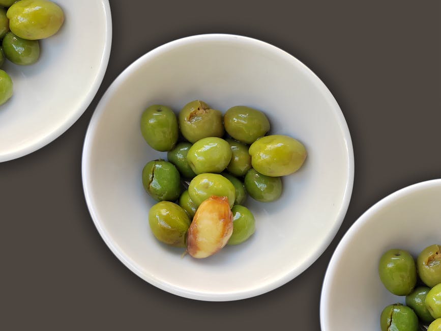 Spanish green olives with garlic in bowls