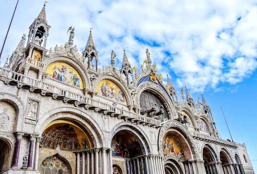 Low angle view of ornate facade of St Marks Basilica Venice