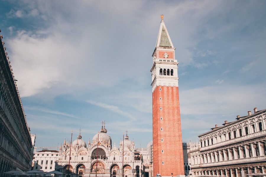 St Mark's Basilica and Campanile in Piazza San Marco Venice under a clear blue sky