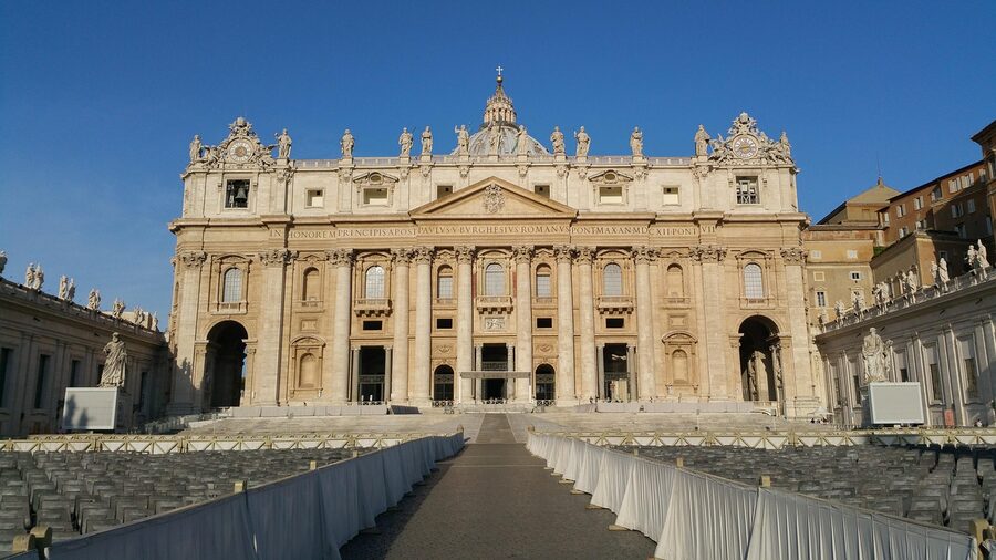 St. Peter's Basilica colonnade with statue Vatican Rome
