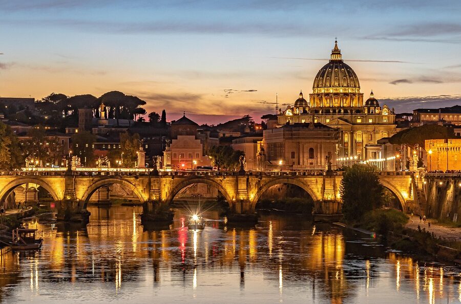 St. Peter's Basilica and Tiber River with bridge at night Rome