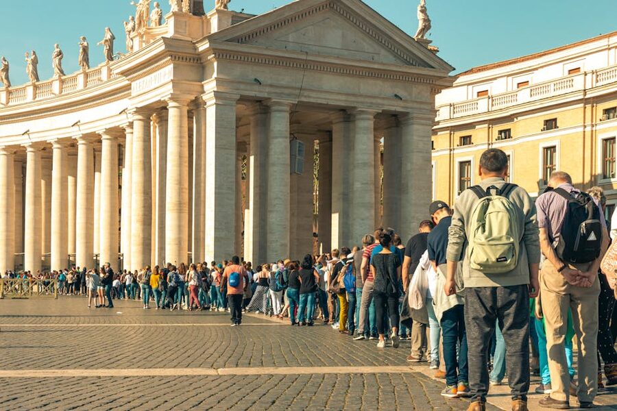 Tourists queuing in St Peters Square Vatican summer