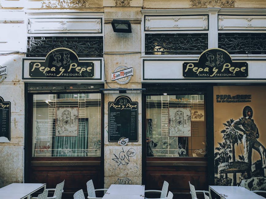Spanish tapas bar storefront with signage and outdoor seating