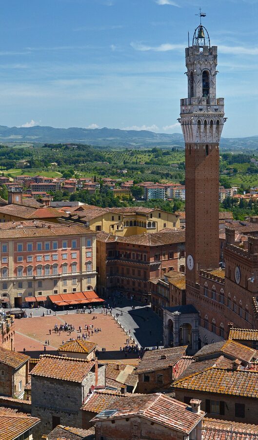 Torre del Mangia bell tower in Siena rising over the Piazza del Campo