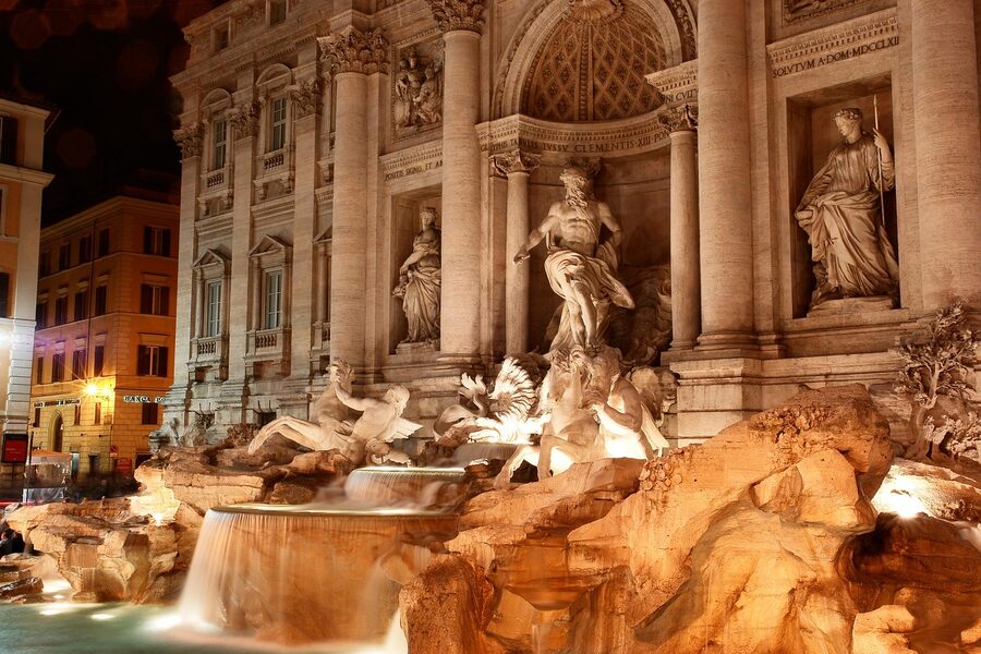 Trevi Fountain wide view with travertine architecture Rome