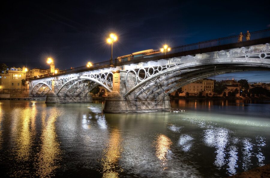 Triana Bridge Seville lit up at night