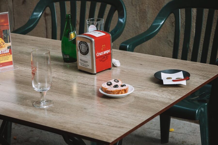 Outdoor cafe table in Valencia old town with horchata and pastry