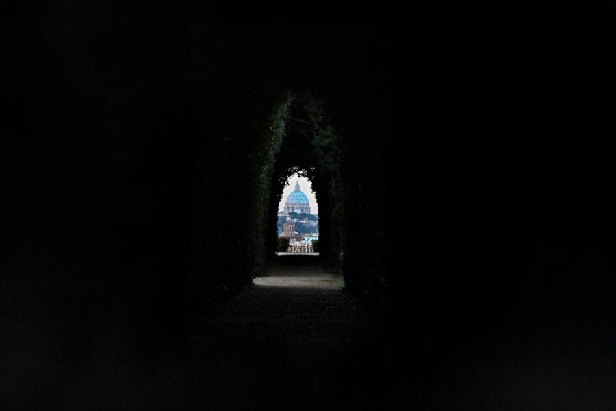 St Peters Basilica through tree tunnel from Vatican Gardens