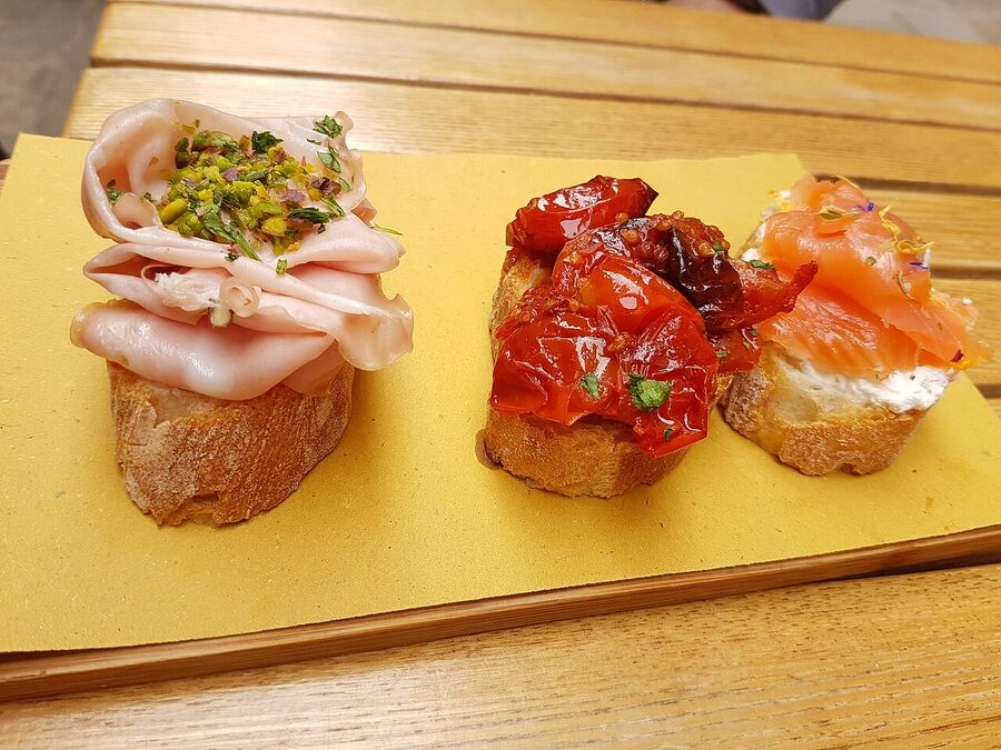 Cicchetti laid out on the counter inside a Venice bacaro