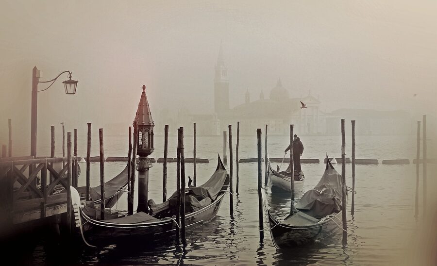 Gondola in fog and mist on a Venice canal