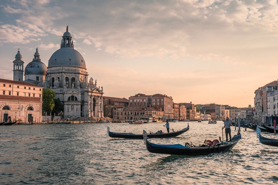 Venice gondolas on a canal at evening