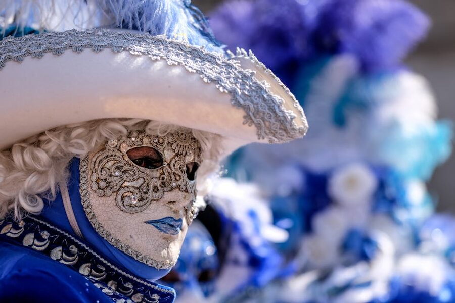 Blue and white Venetian carnival costume with mask
