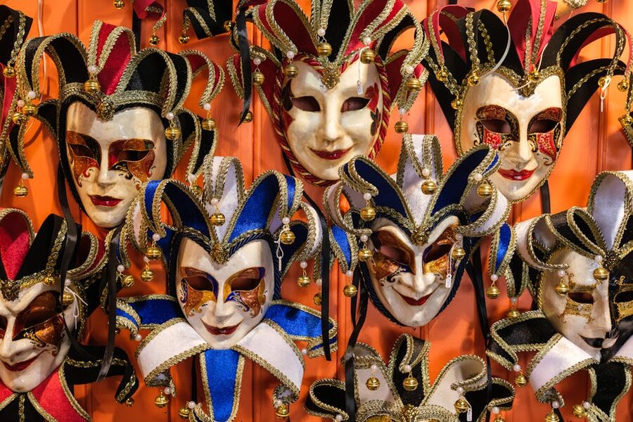 Traditional Venetian masks on display in a workshop