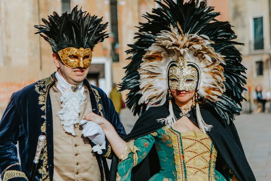Venice carnival couple in feathered masks