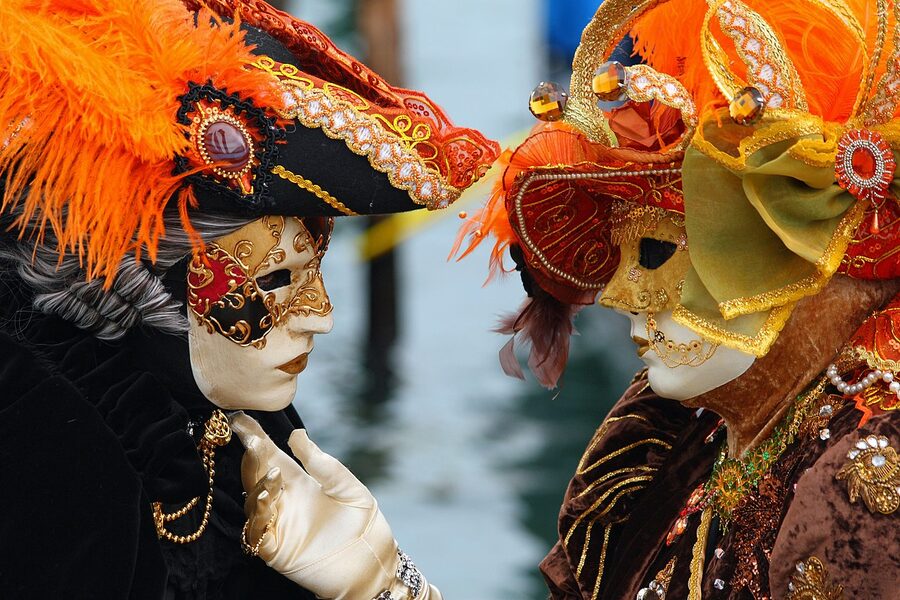 Two costumed figures at the Venice Carnival